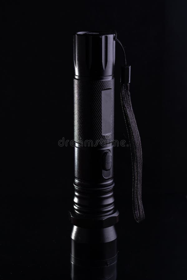 Black Tactical Flashlight on a Black Background Stock Photo - Image of ...