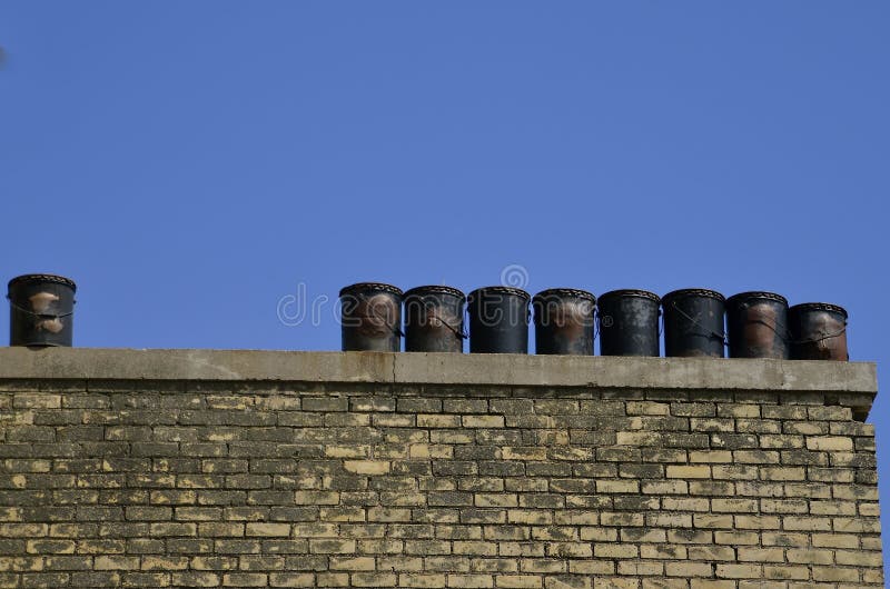 Black Tar Pails Setting on Roof Ledge Stock Image - Image of repair ...