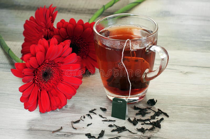 Black Tea and Beautiful Flowers Stock Photo - Image of beautiful ...