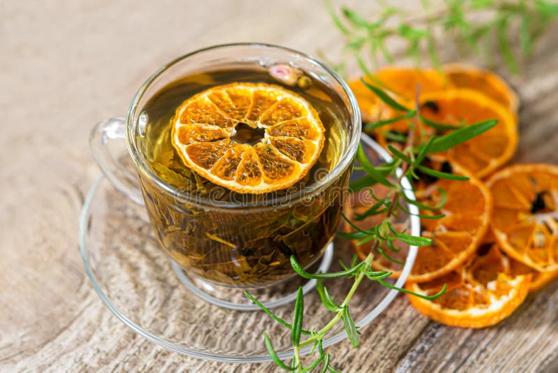 Black Tea. Cup of Tea with Dried Orange and Rosemary Stock Photo ...