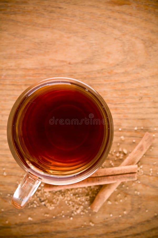 Black Tea in Glass with Cinnamon and Cane Sugar Stock Image - Image of ...