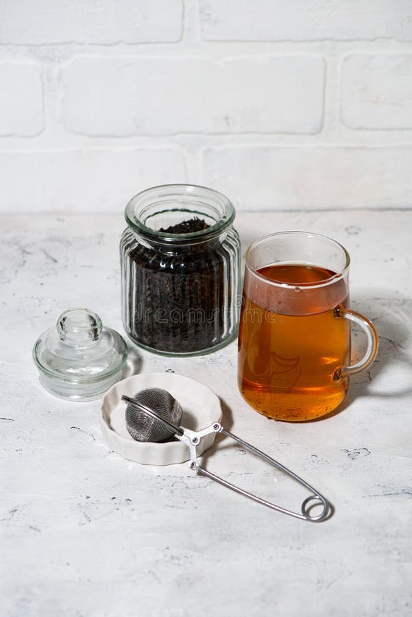 Black Tea in a Glass Cup and Ingredients for Brewing, Vertical Top View ...