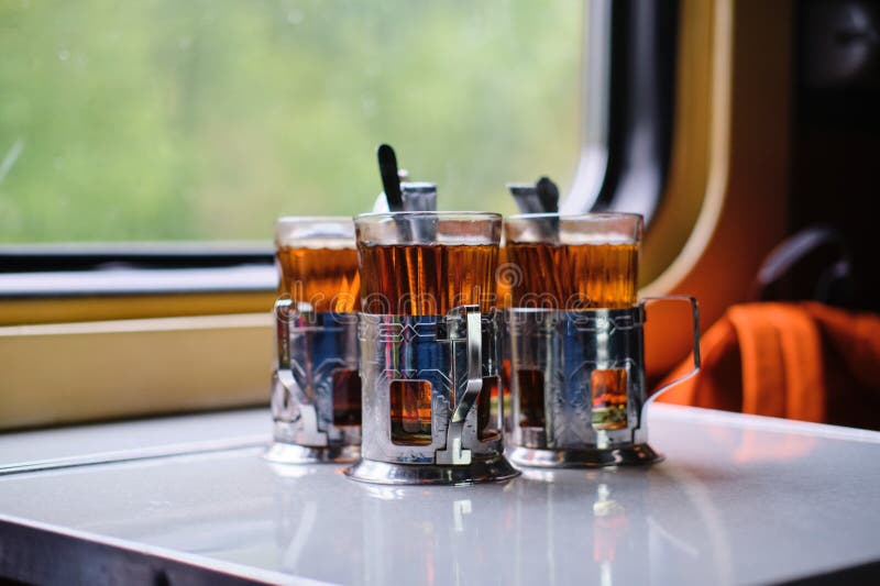 Black Tea Glasses in Cup Holders on a Table on a Train Stock Photo ...