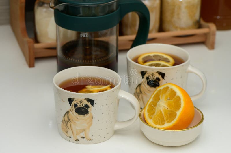 Black Tea with Lemon in Cups with a Drawn Pug 6 Stock Photo - Image of ...