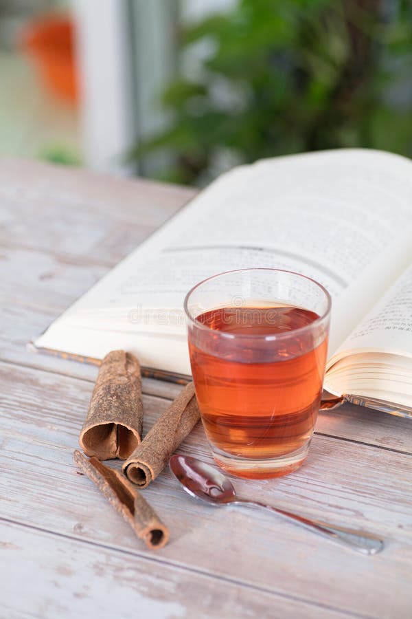 Black tea and an open book stock image. Image of still - 228844709