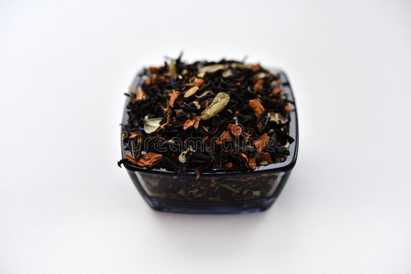 Black Tea with Spices in a Glass Cup on a White Background. Delicious ...