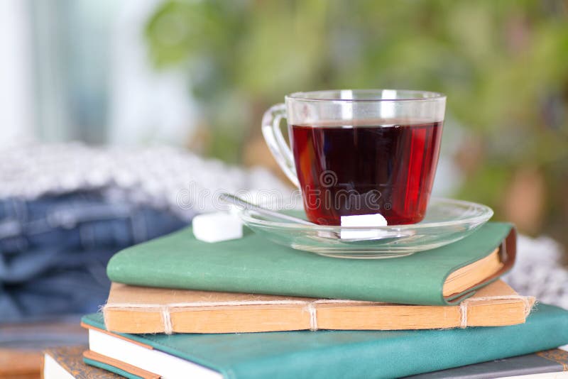 Black Tea on a Stack of Books Stock Image - Image of still, glass ...