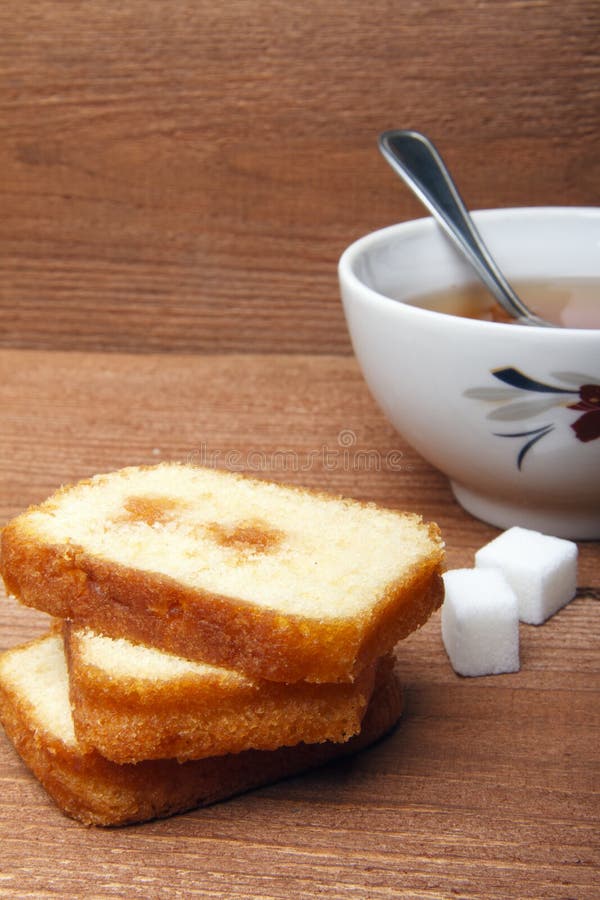 Black Tea with Sugar and Cake with Jam on Wooden Background Stock Photo ...