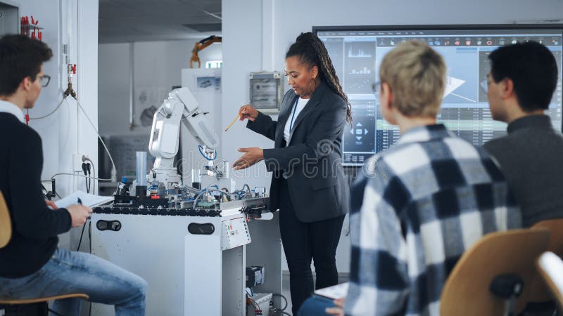 University Robotics Class: Black Teacher Explaining Engineering To ... University Robotics Class: Black Teacher Explaining Engineering To ...