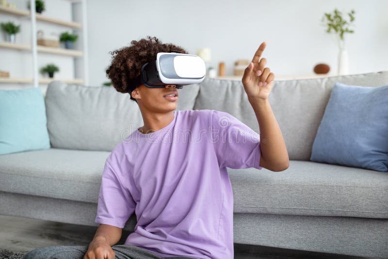 Black Teen Guy in VR Headset Exploring Virtual Reality at Home ...
