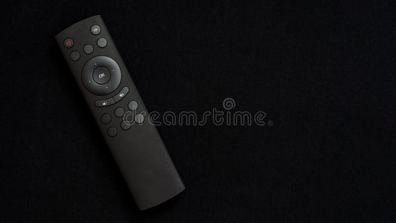 Black Television Remote Control on a Black Embossed Background. TV ...