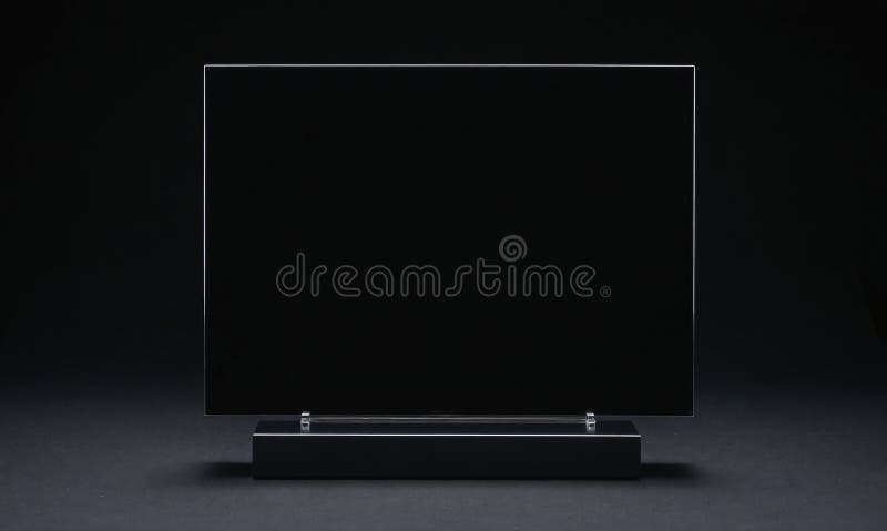 A Black Television Sits on a Black Stand Against a Black Backdrop Stock ...