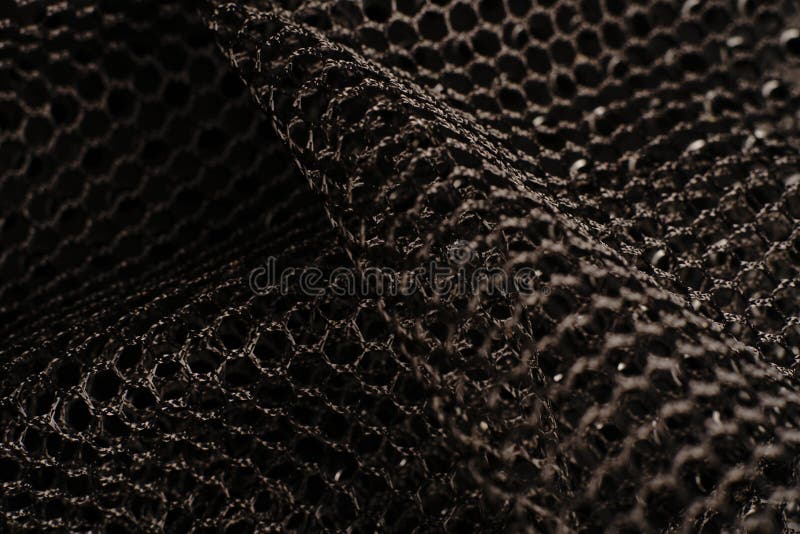Black Texture. a Black Net is Placed on a Black Perforated Metal Table ...