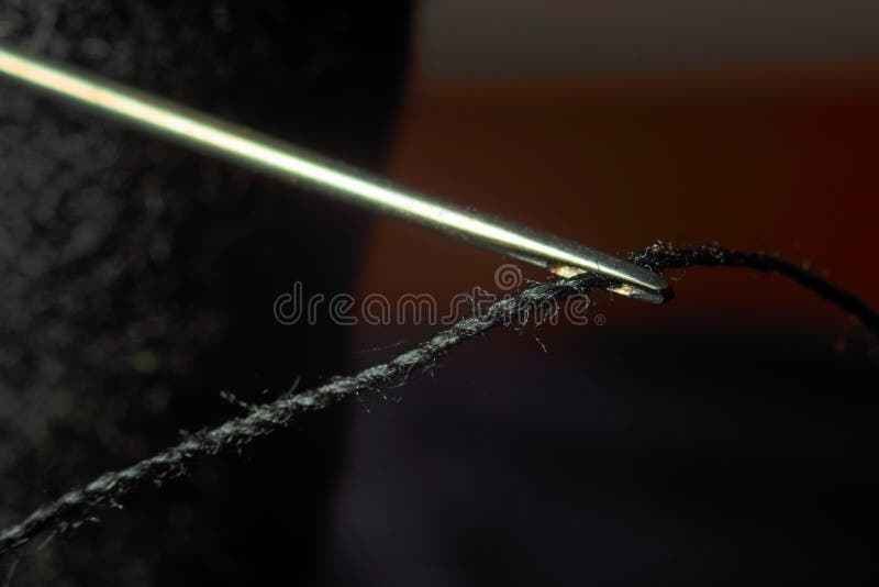 Black Thread through a Needle Stock Photo - Image of design, light ...