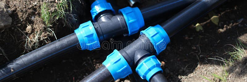 Black Three Way Plastic Water Pipe on Grass Stock Photo - Image of ...