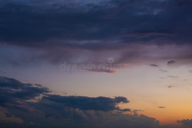Black Thunderclouds at Sunset. Bright Orange Sunset and Dark Clouds ...