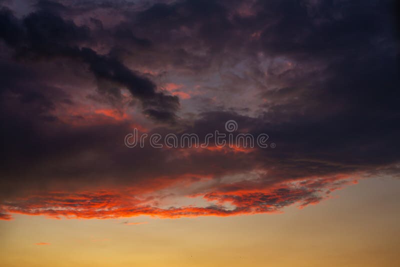 Black Thunderclouds at Sunset. Bright Orange Sunset and Dark Clouds ...