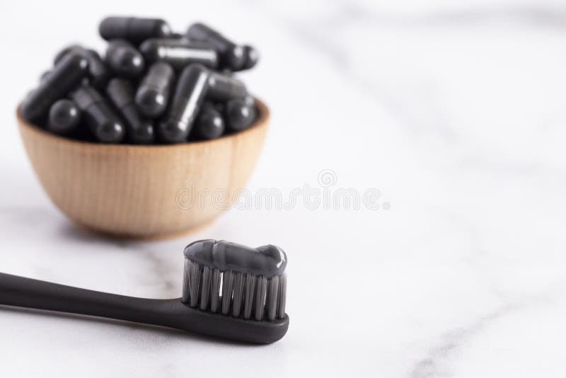 Black Toothpaste with Capsule of Activated Charcoal Stock Image - Image ...