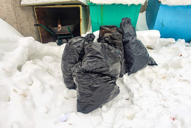 Black Trash Bags on the Snow Stock Photo - Image of junk, abandoned ...