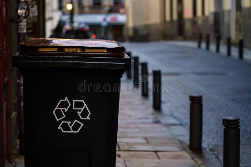 Black Trash Can on the Side of the Street Stock Image - Image of ...