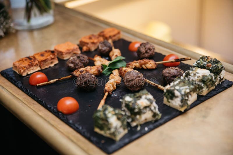 Black Tray Filled with an Assortment of Appetizers and Snacks, Perfect ...