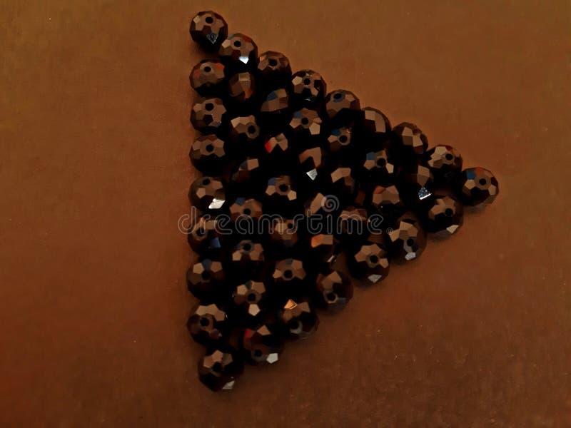 Black triangular beads stock image. Image of design - 204745221