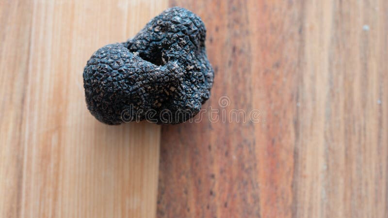 Black Truffle on Wood Cutting Board Stock Photo - Image of full ...