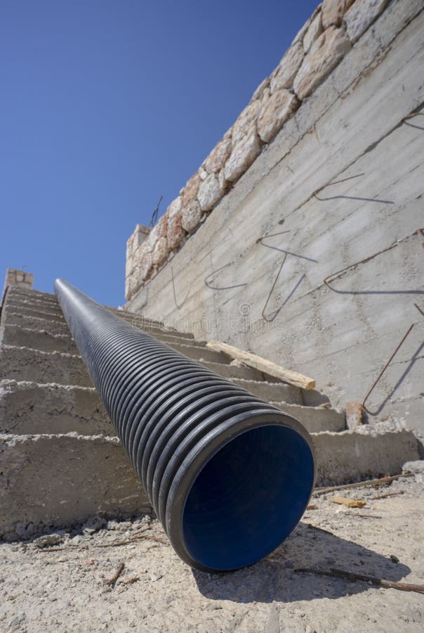 Black Tube on Construction Site Stock Photo - Image of site, sanitation ...