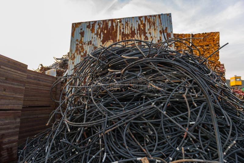 Black Tube Stack Filled with Wire Rope in a Junkyard Stock Photo ...