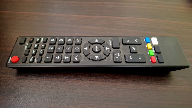 Black TV Remote Control on Wooden Surface Stock Photo - Image of media ...