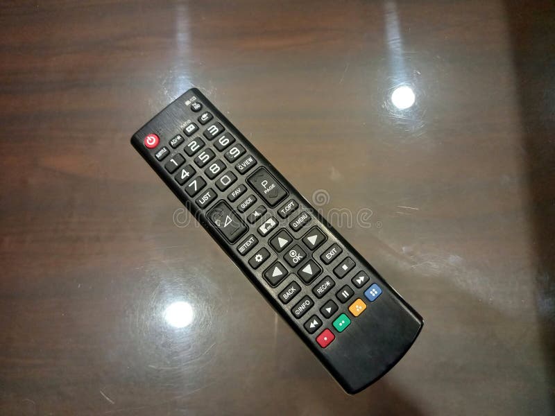 Black Tv Remote on the Table Stock Photo - Image of blue, yellow: 230894056