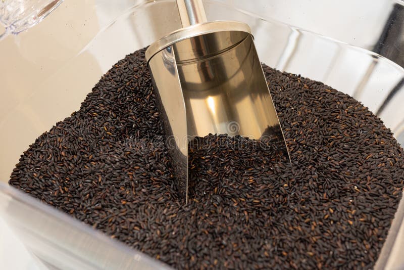 Black Uncooked Rice Inside Big Bowl and Metallic Spoon Stock Photo ...