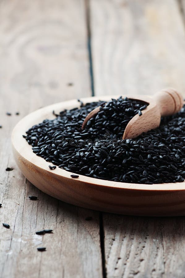 Black Uncooked Rice on the Wooden Table Stock Image - Image of rice ...