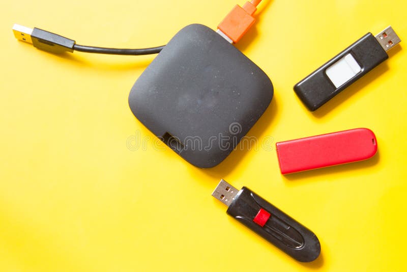 Black USB HUB with Usb Stick Flash Drives on Yellow Background. Top ...