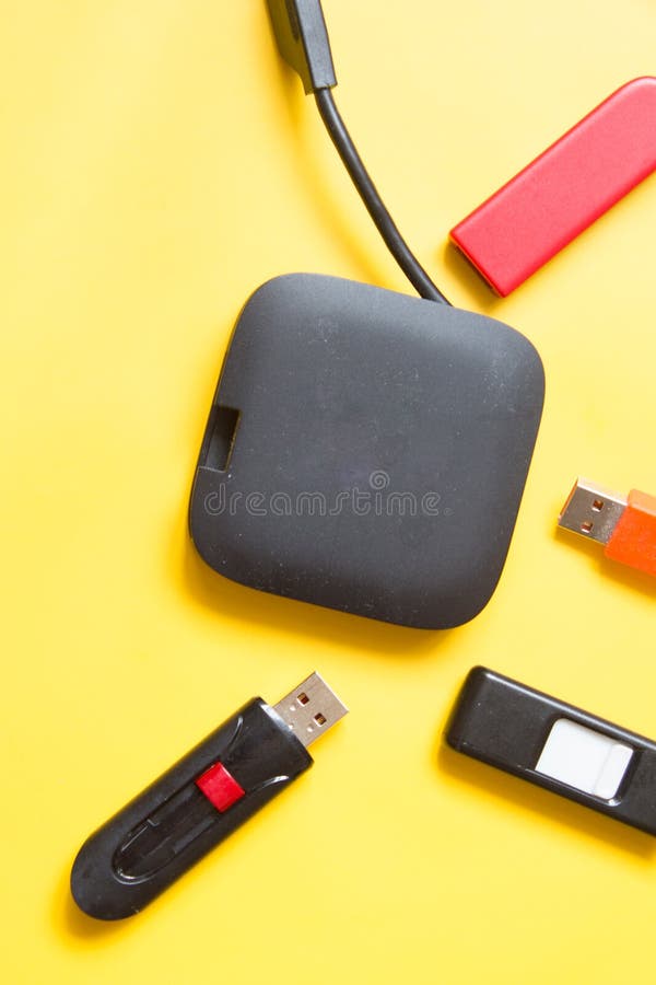 Black USB HUB with Usb Stick Flash Drives on Yellow Background. Top ...