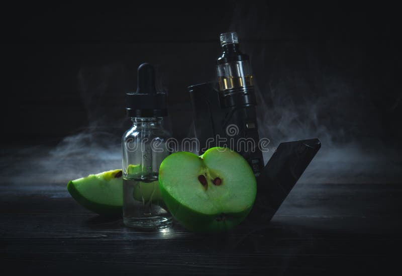 Black Vaporizer in the Smoke with Sliced Apple Stock Image - Image of ...