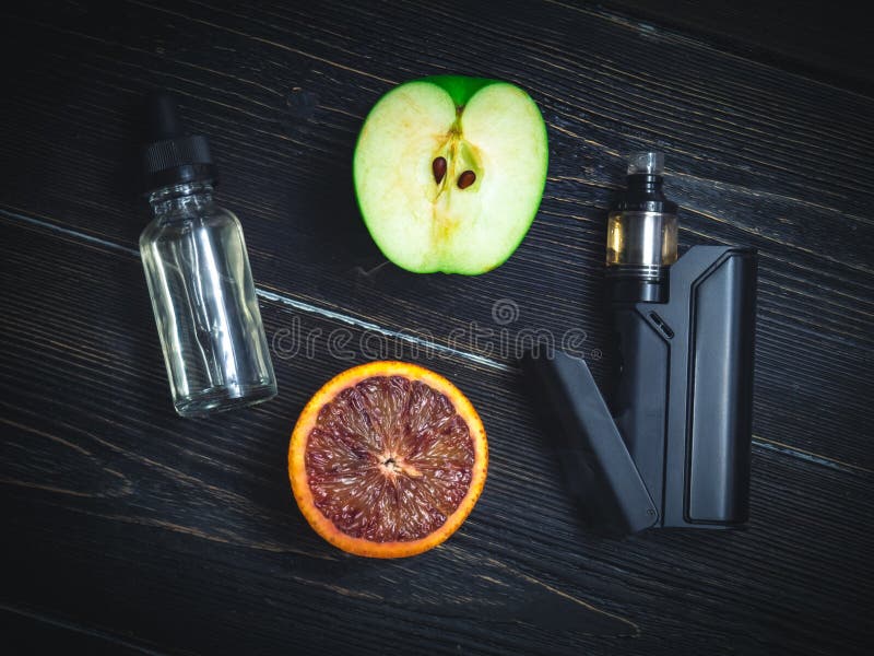 Black Vaporizer in the Smoke with Sliced Orange-apple Stock Image ...