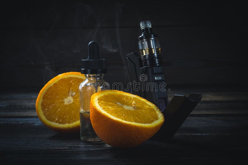 Black Vaporizer in the Smoke with Sliced Orange Stock Image - Image of ...