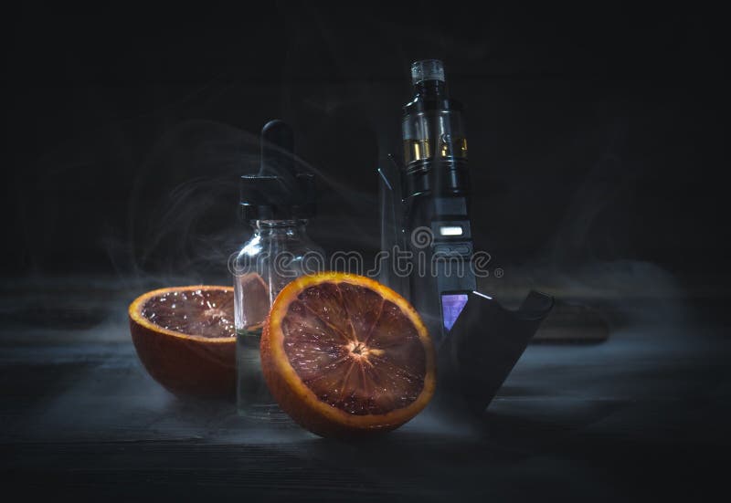 Black Vaporizer in the Smoke with Sliced Orange Stock Image - Image of ...