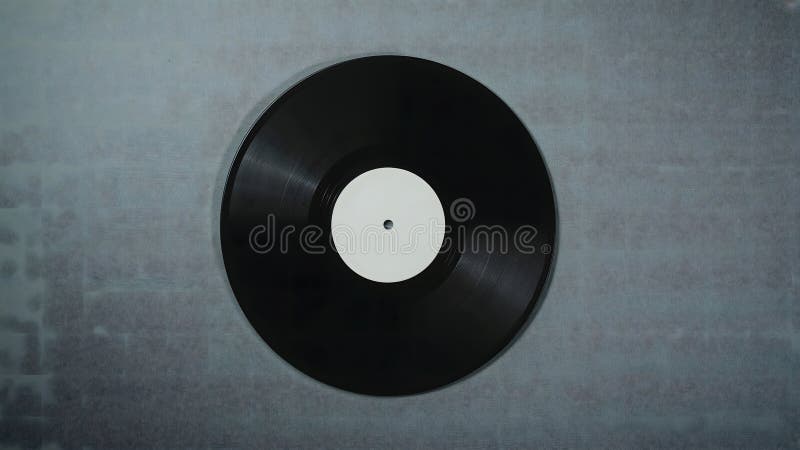Black Vinyl Record with White Center Label on Gray Surface Stock ...