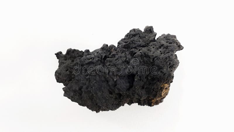 Black Volcanic Rock on a White Background, Remarkable Details of this ...