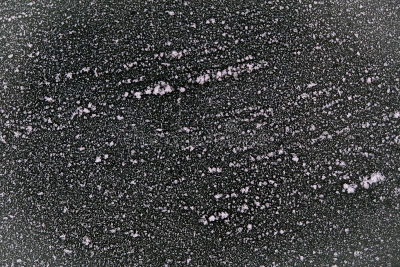 The Black Wall is Covered with Snow Patterns. Frost on Painted Wall ...
