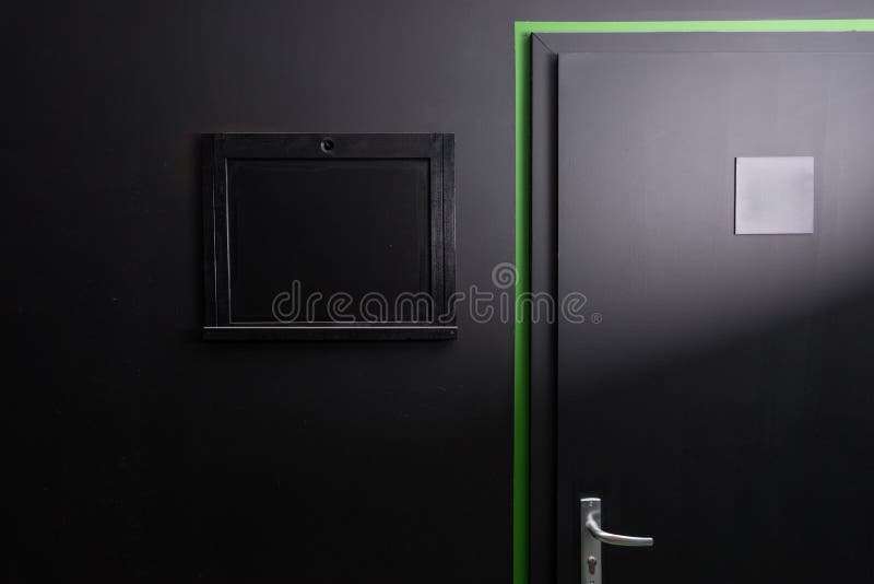 Black Wall, Door and Covered Window Hatch Stock Photo - Image of ...