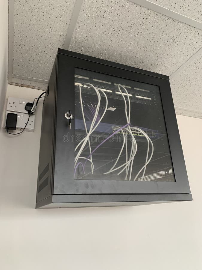 Black Wall Mounted it Cabinet with a Network Switch and Patch Panel ...
