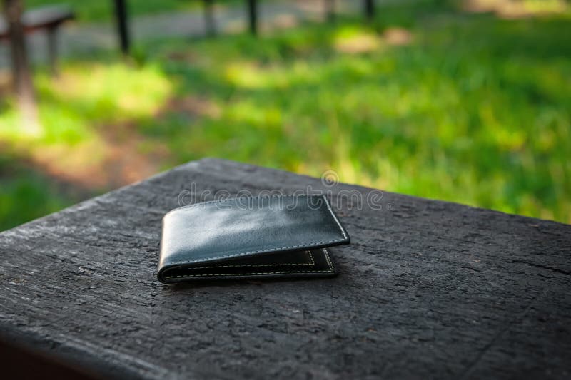 Black Wallet on Bench Outdoors. Lost and Found Stock Image - Image of ...