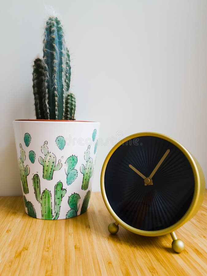 Black Watch with a Gold Frame on a Wooden Table Stock Photo - Image of ...