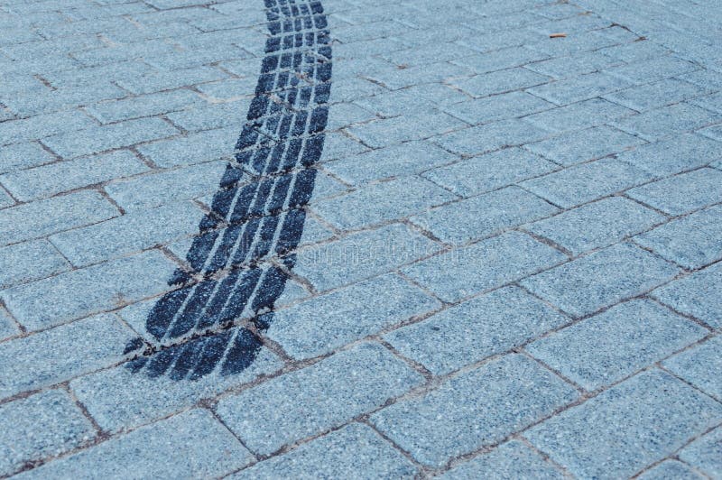 Black Wheel Trace on the Cobblestone Ground Stock Image - Image of ...