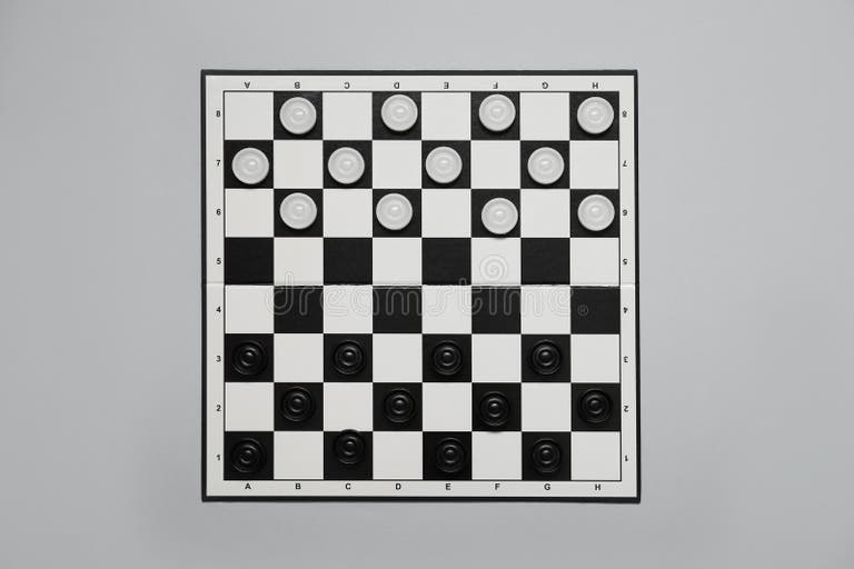 Black and White Checkerboard with Game Pieces on Light Grey Background ...