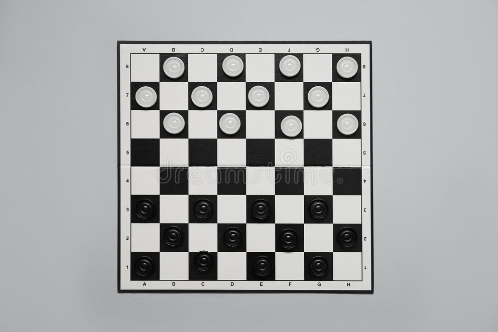 Black and White Checkerboard with Game Pieces on Light Grey Background ...