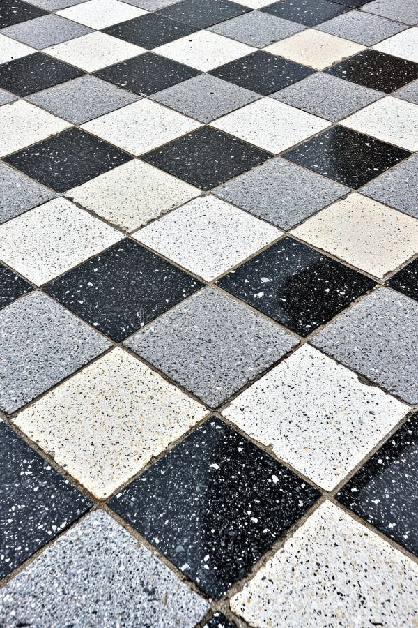 Black and White Checkerboard Pattern on Ground with Textured Surface ...